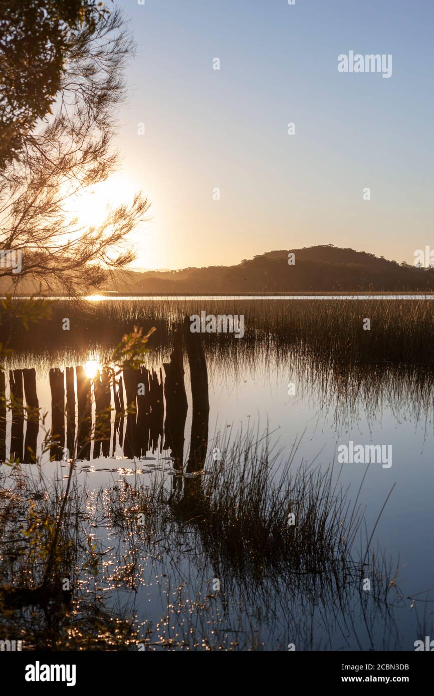 Sunrise over the calm lake Stock Photo - Alamy