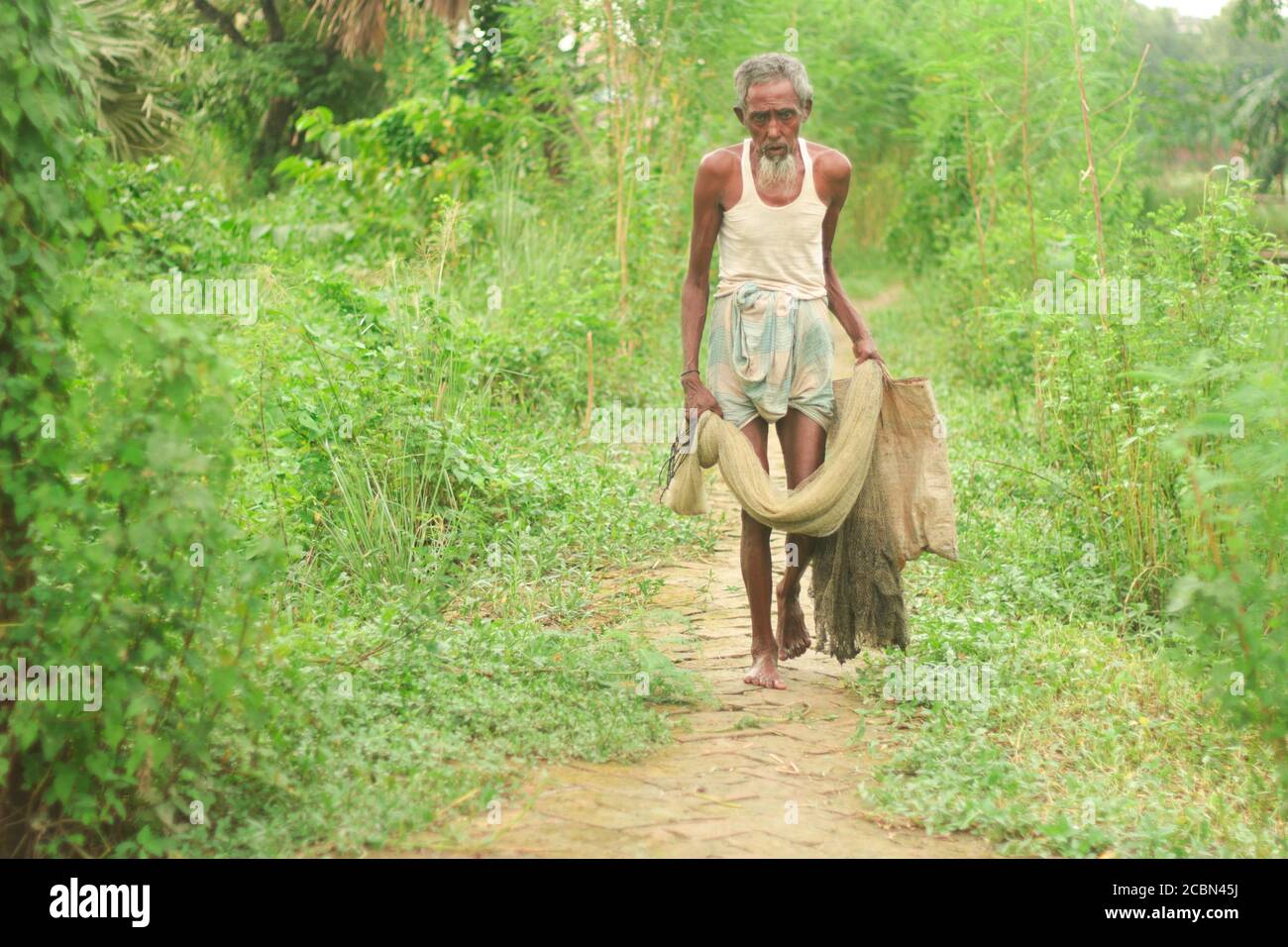 Villager old fisherman closeup. Rural fisherman life Stock Photo - Alamy