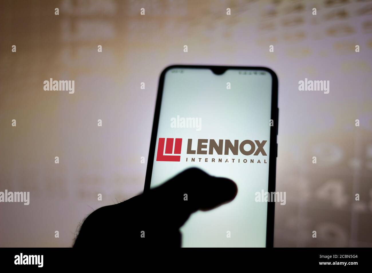 In this photo illustration the Lennox International logo seen displayed ...