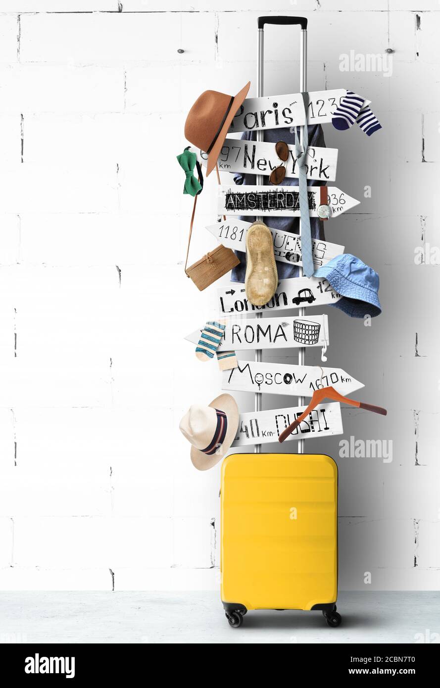 Travel suitcase with wooden signs and hanging clothes and accessories ...