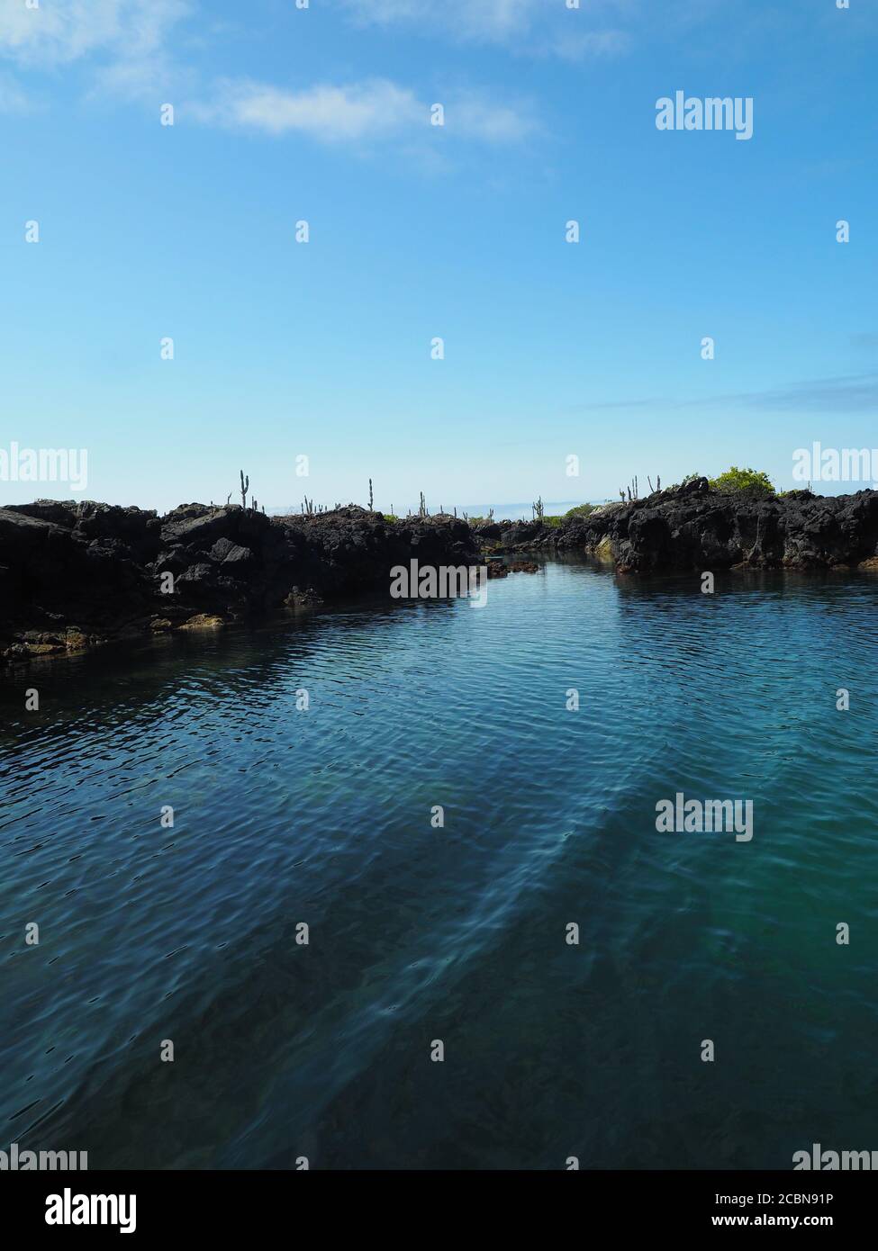 Stunning view of water surrounded by rocks Stock Photo - Alamy