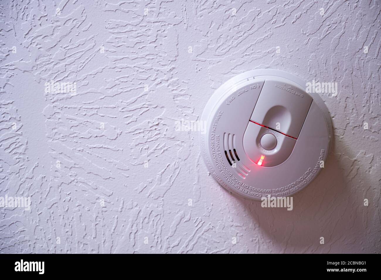Residential smoke detector with indicator light Stock Photo - Alamy