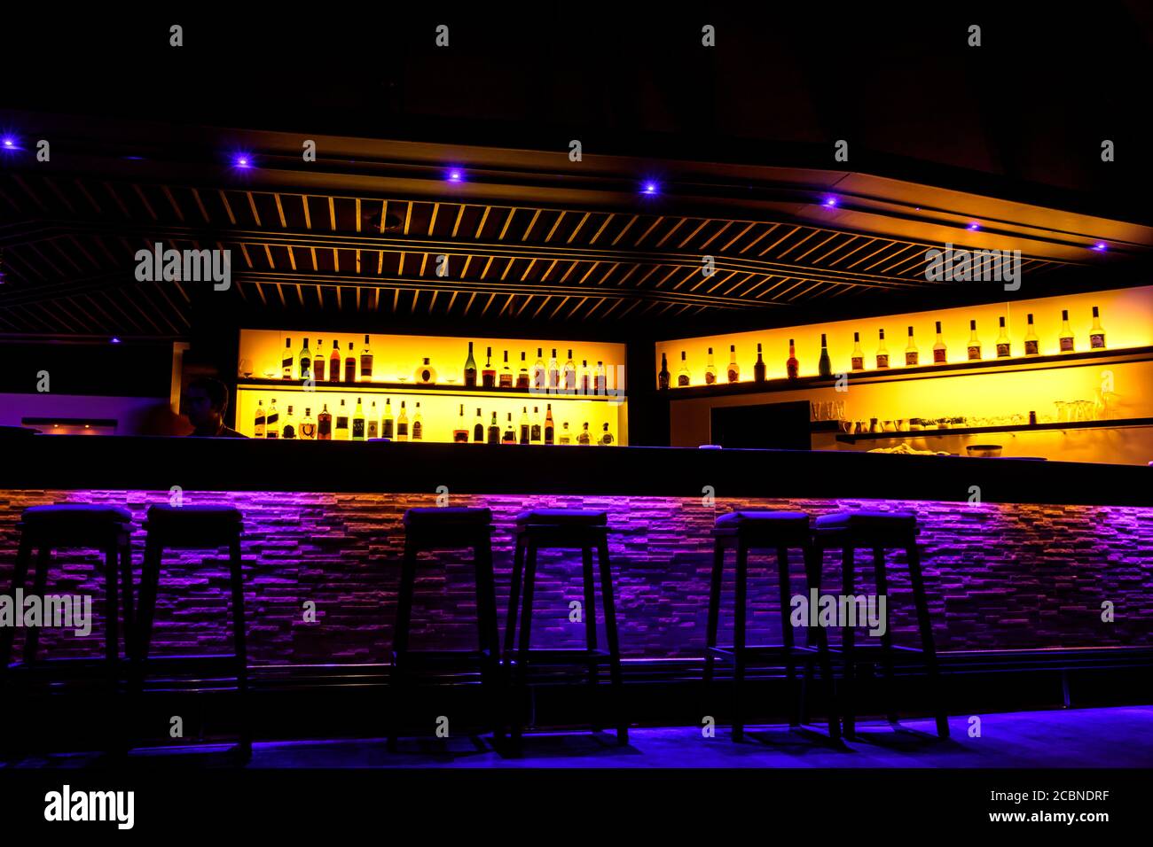 MALE, MALDIVES - Jun 22, 2017: Bar counter with dim lit beautiful ...