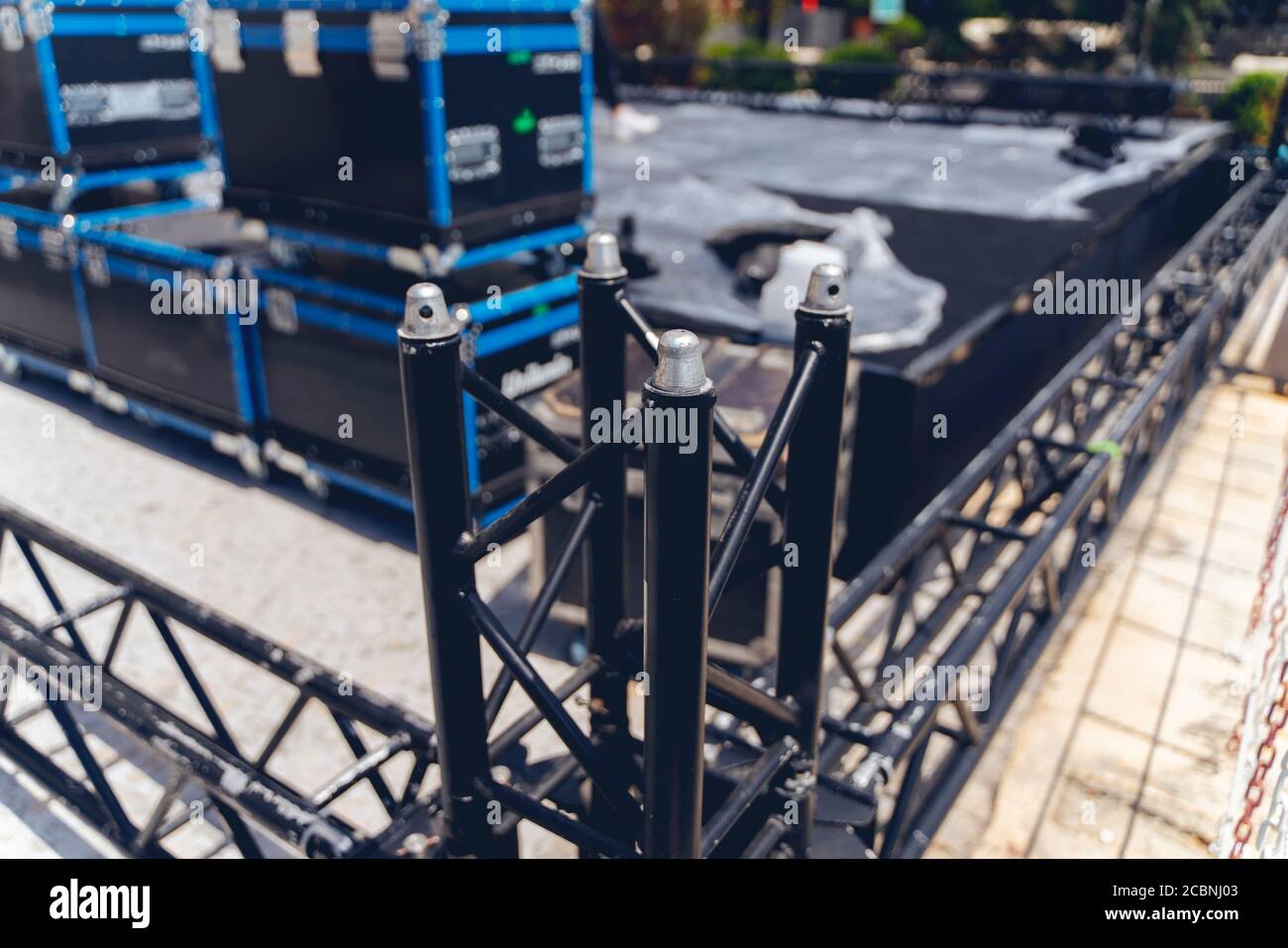 Stage light equipment boxes and metal frame, closeup of photo. Stack of ...