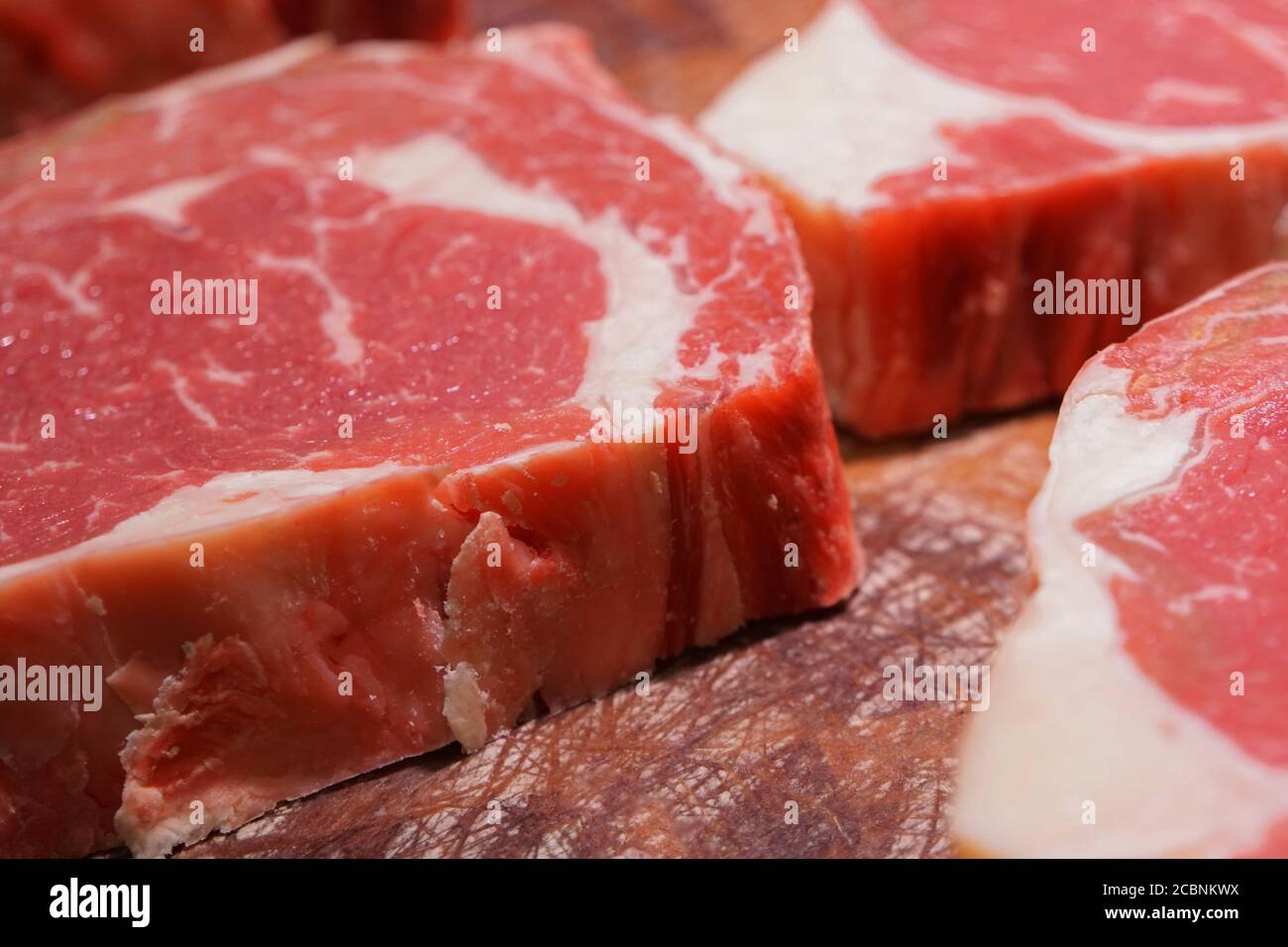 Higgins family butcher, rib eye close up on the chopping board, the ...
