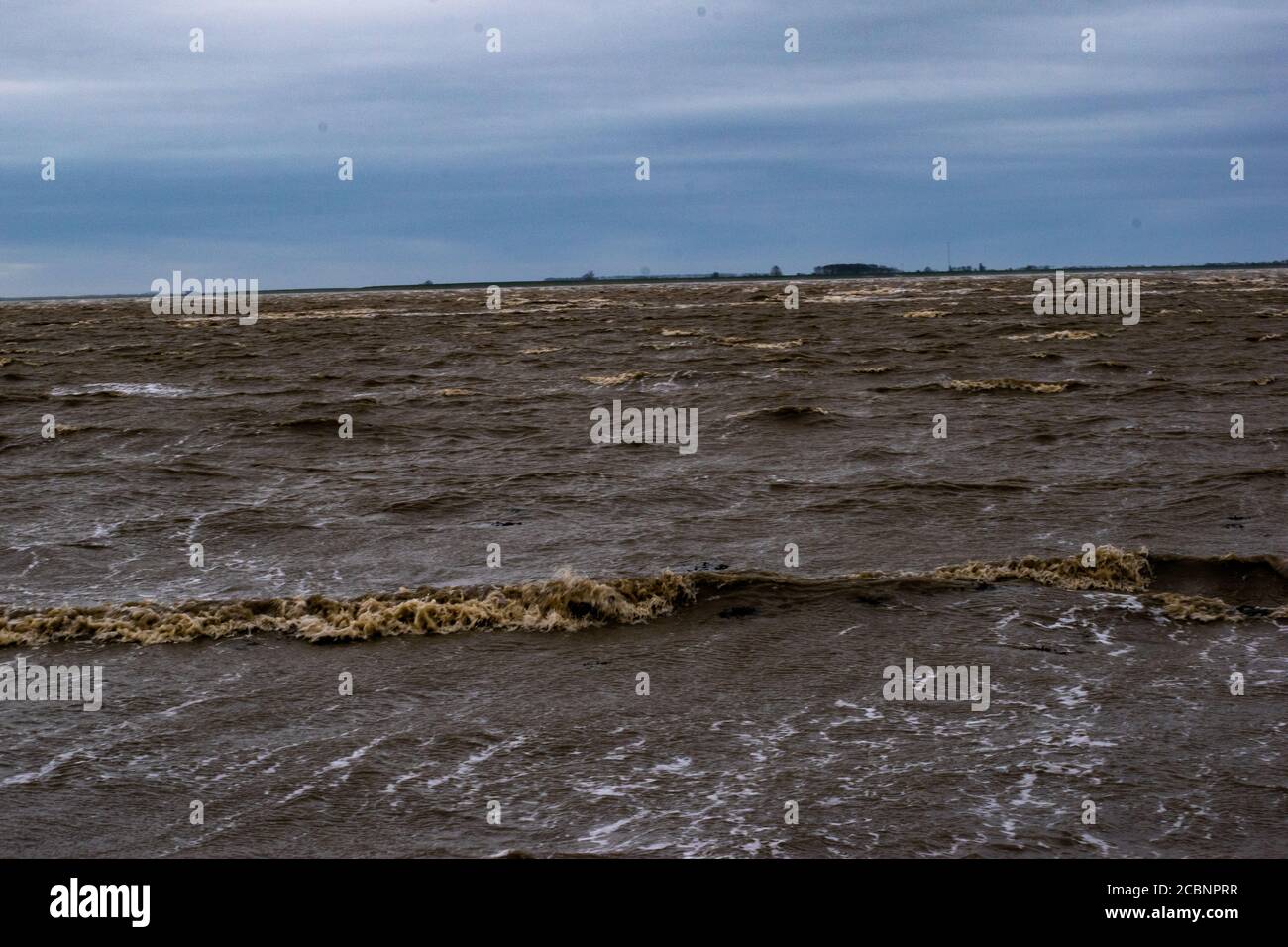 Beautiful seascape with partly collapsed seawall in it Stock Photo - Alamy
