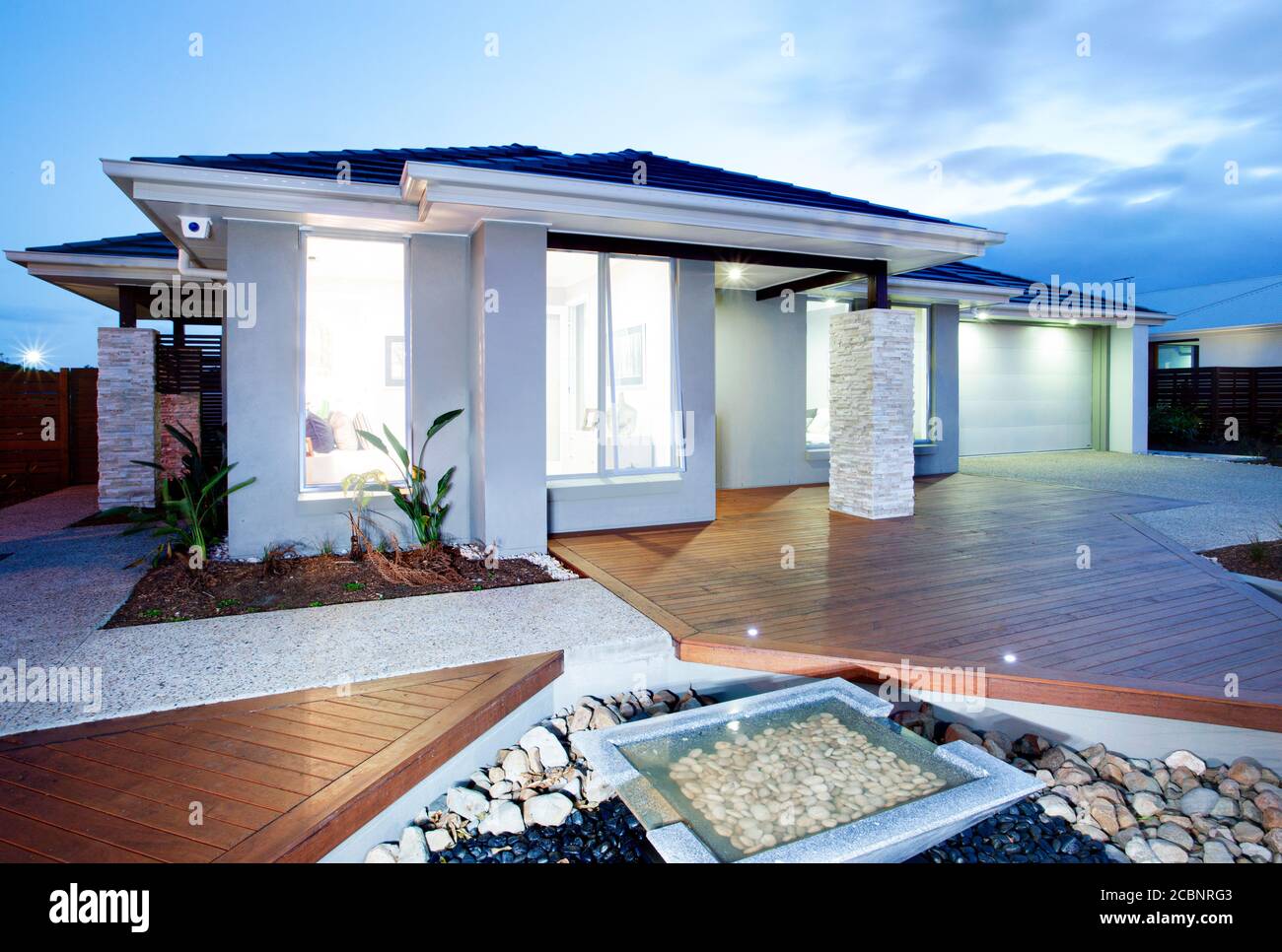 Fron view of a modern house with garage Stock Photo - Alamy