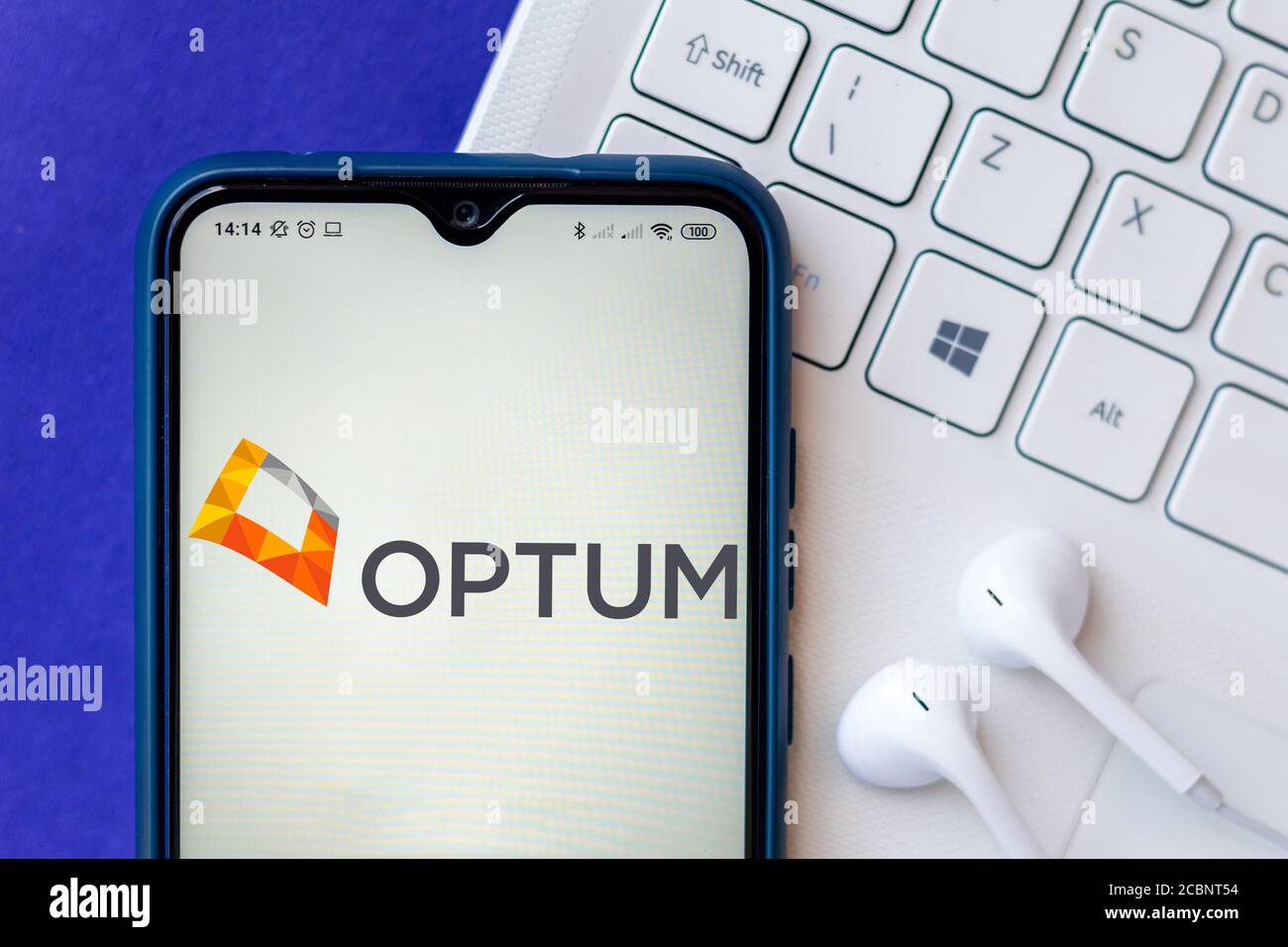 In this photo illustration the Optum logo seen displayed on a smartphone Stock Photo - Alamy
