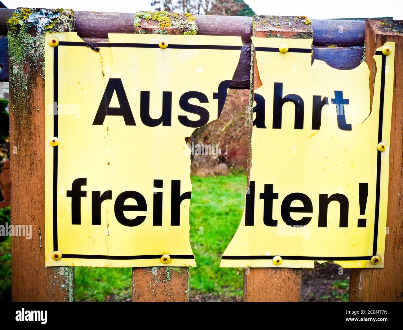 Closeup shot of "keep the exit clear" torn sign Stock Photo - Alamy
