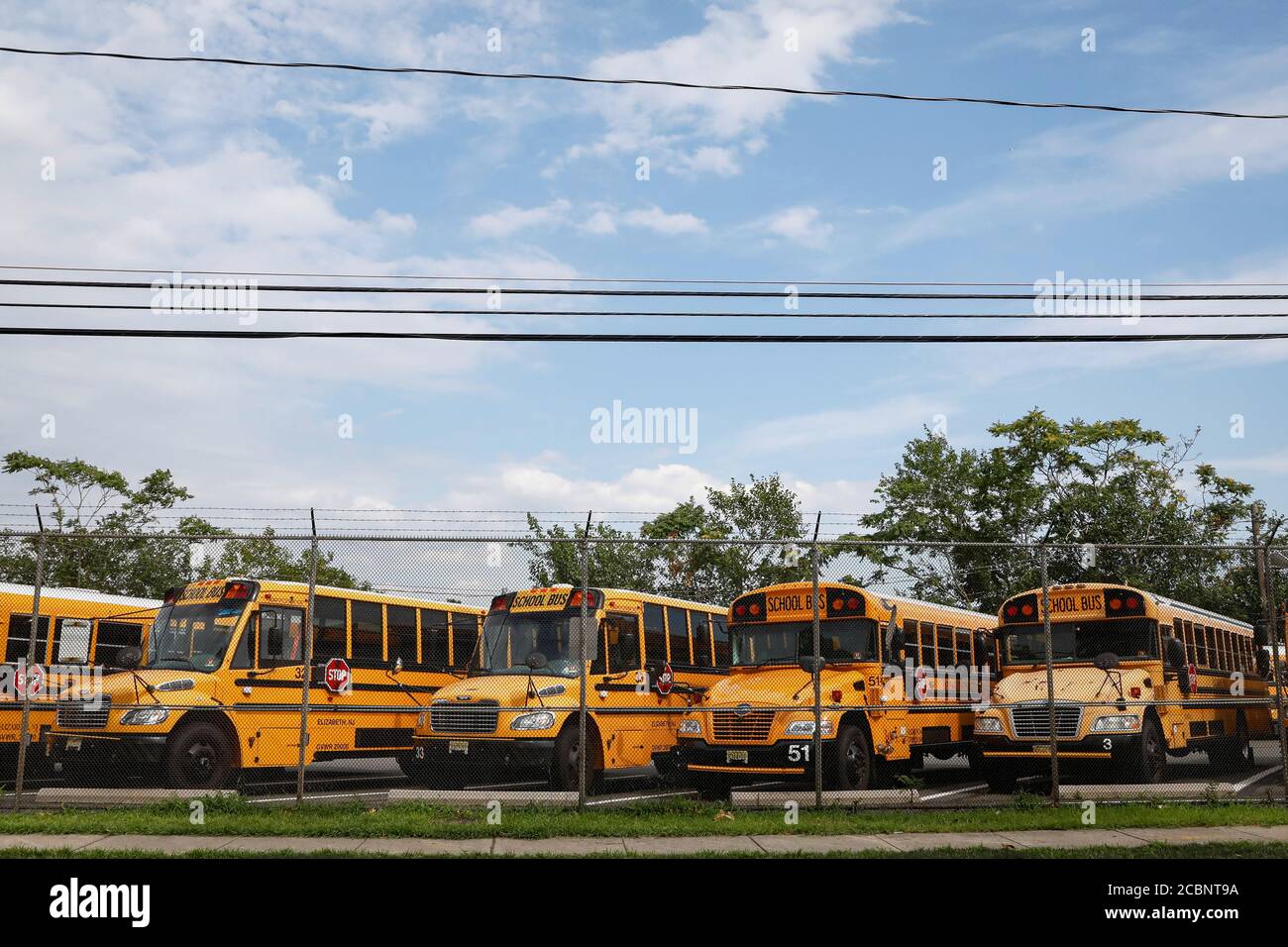 School buses depot hi-res stock photography and images - Alamy
