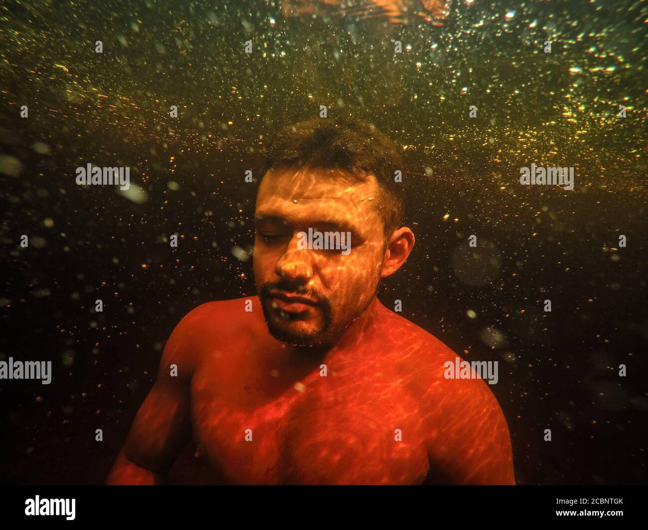 Man under water Stock Photo - Alamy