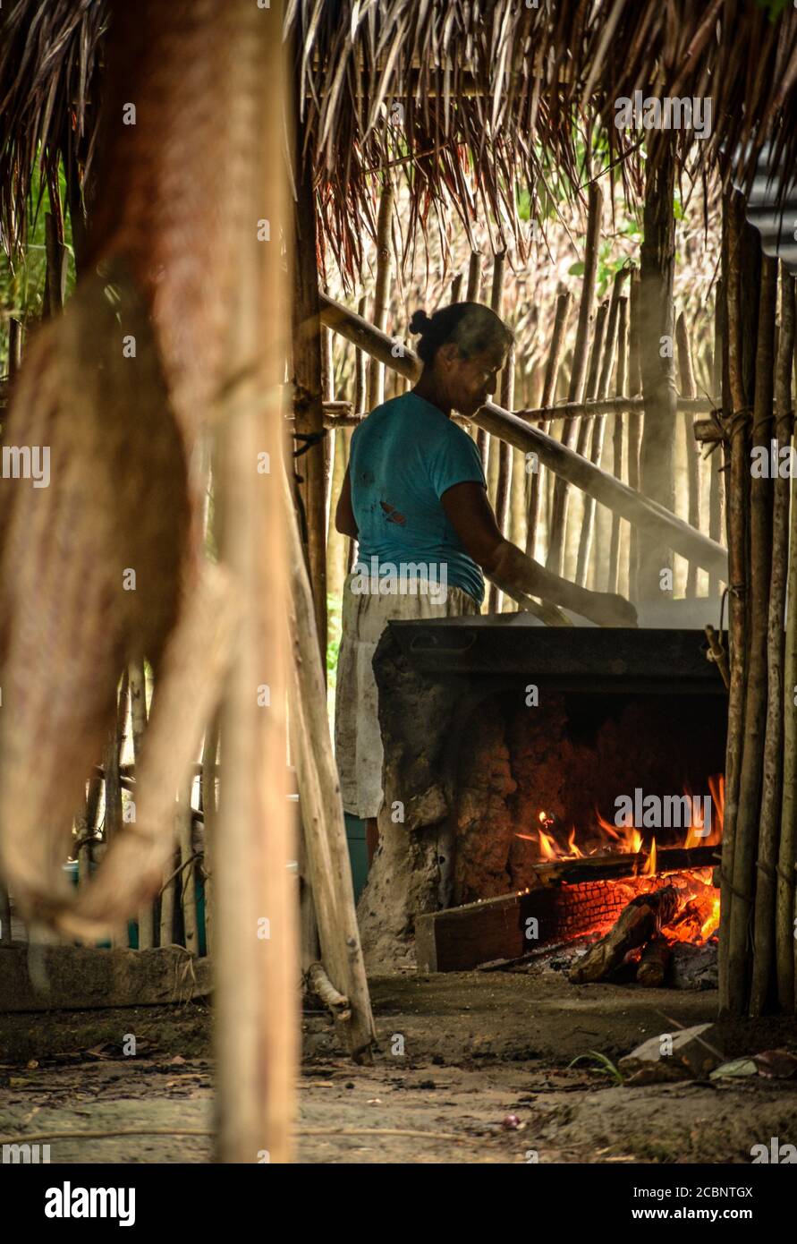 Indigenous woman cooking Stock Photo - Alamy