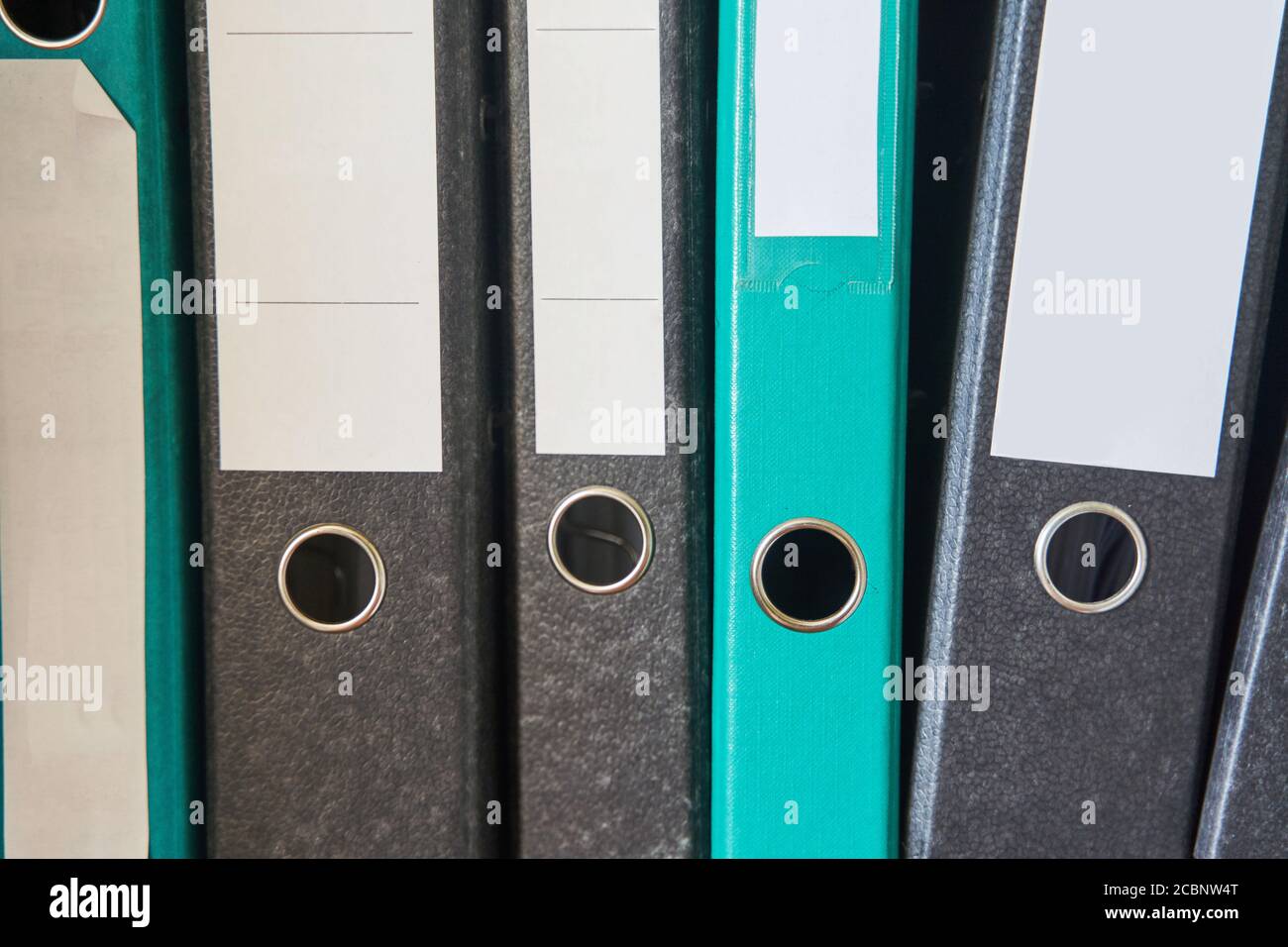 Colored folders for office files and paper on a shelf. Background image ...