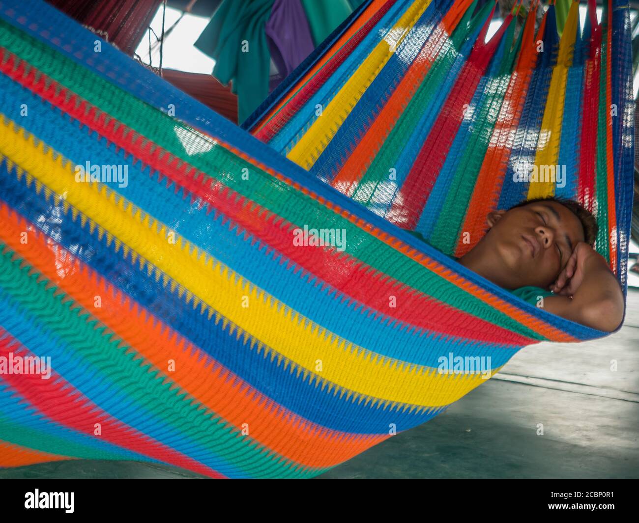 Amazon River, Peru - Dec 08, 2019: Portrait of man sleeping on the ...