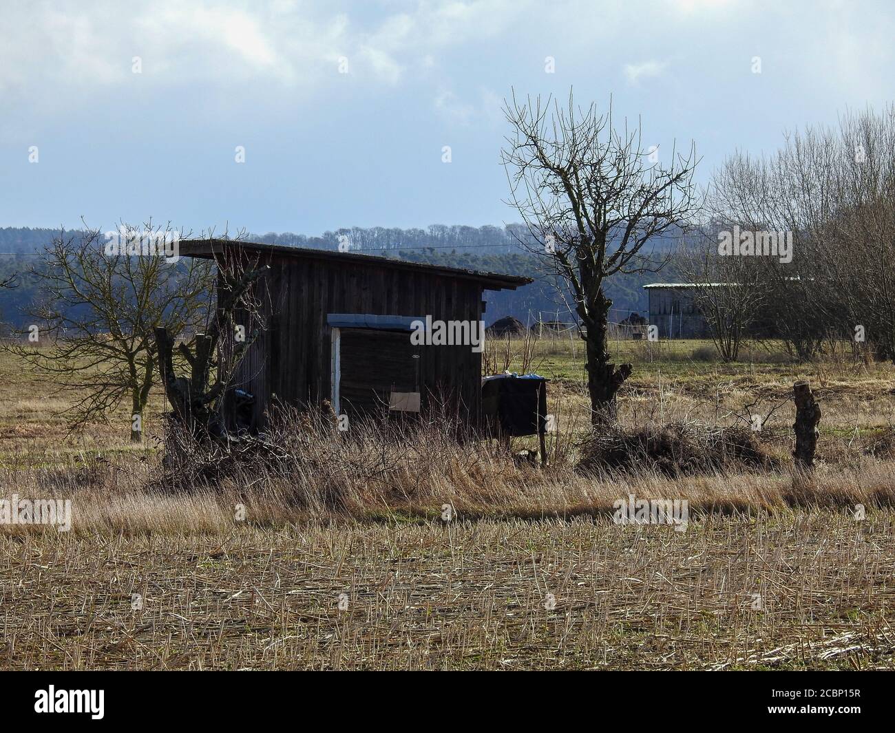 Small wooden hut in a valley in the countryside Stock Photo - Alamy