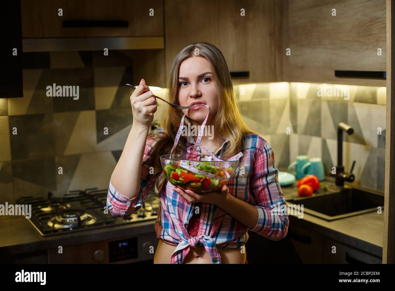 girl fitness trainer vegetarian nutritionist prepare fresh vegetable ...