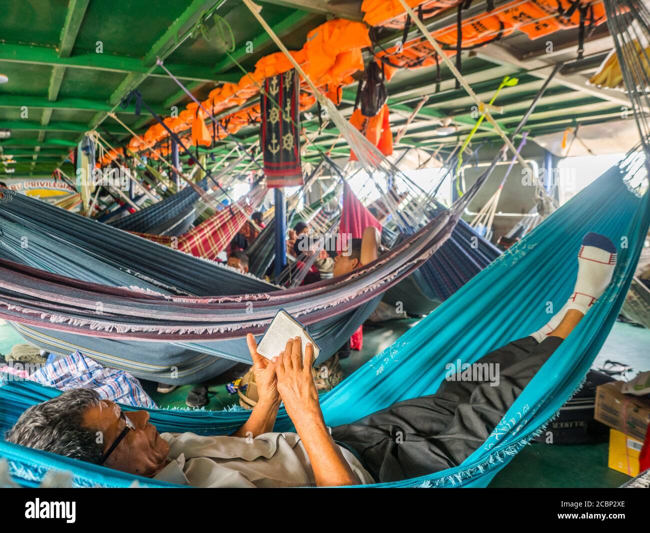Amazon River, Peru - Decemberr 9, 2019: Man praying while laying on ...