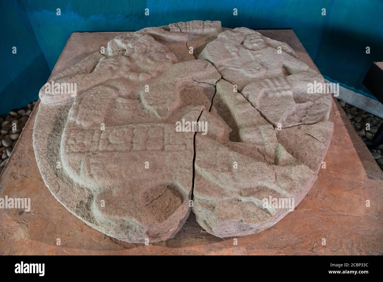 A carved stone tablet in the museum at the ruins of the Mayan city of ...