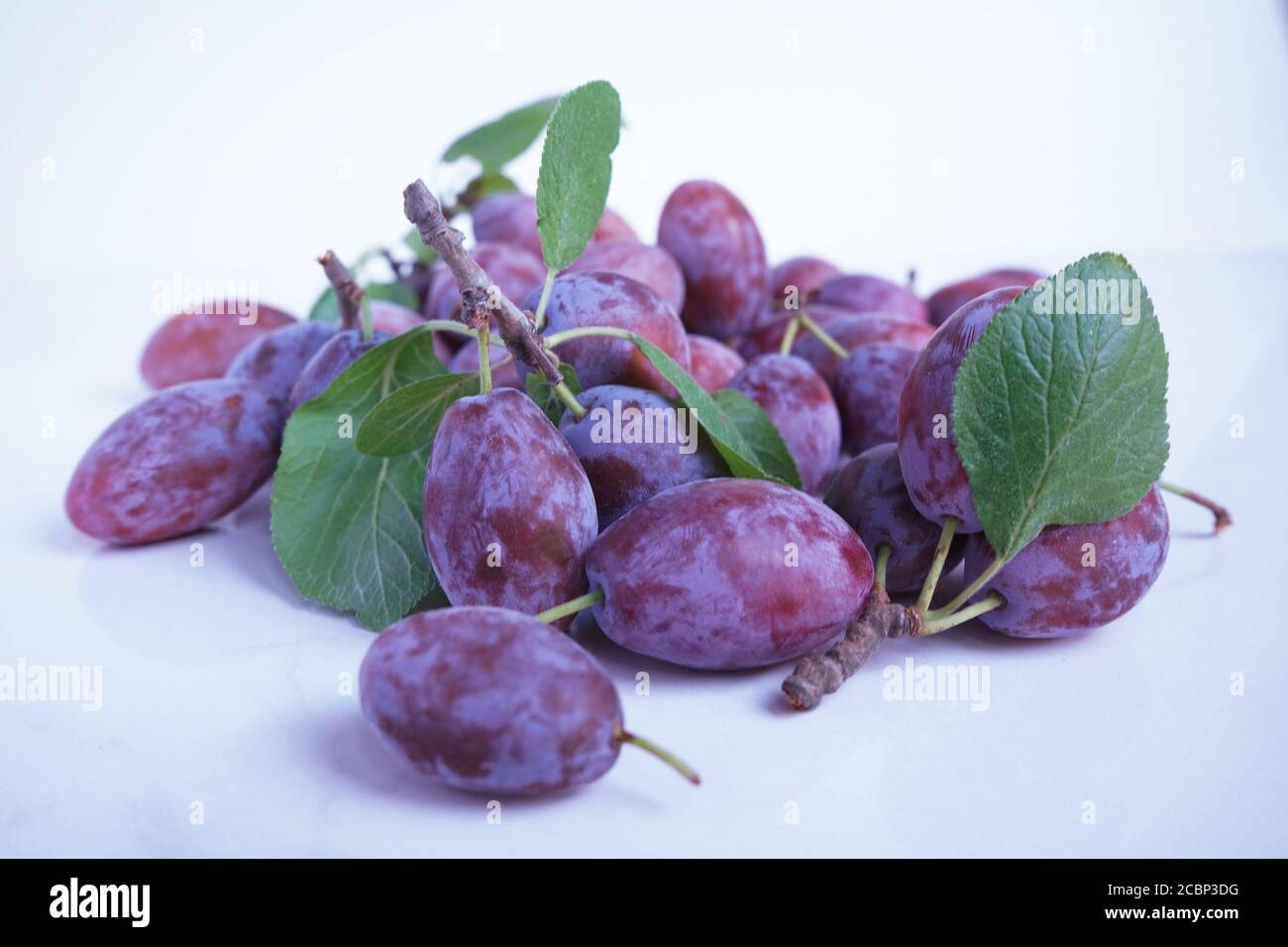 Macro photo food fruit plum on a white background. Texture background ...