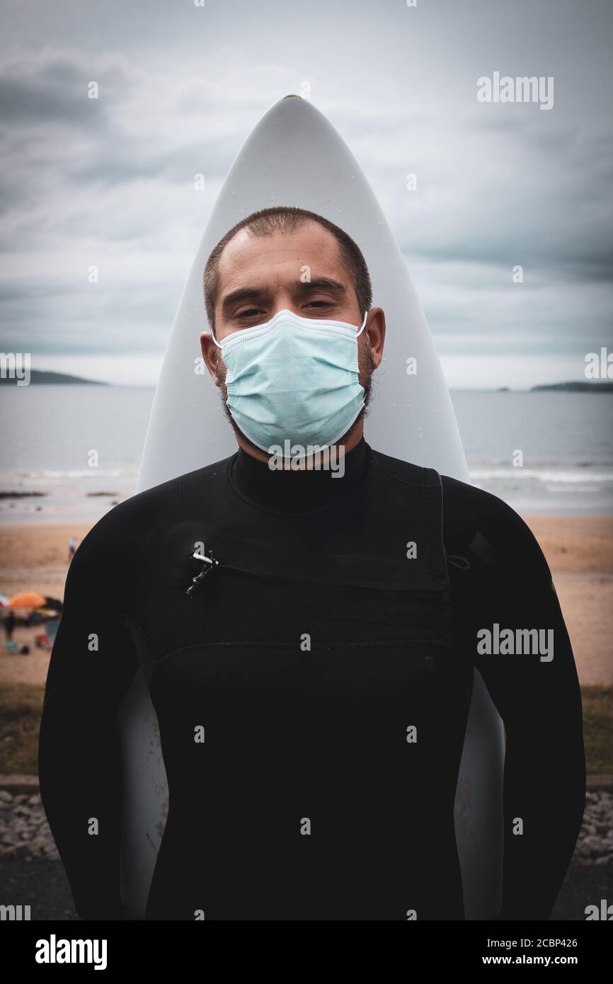 Surfboard Surfer, Man in Mask and Wetsuit on the Beach Stock Photo - Alamy