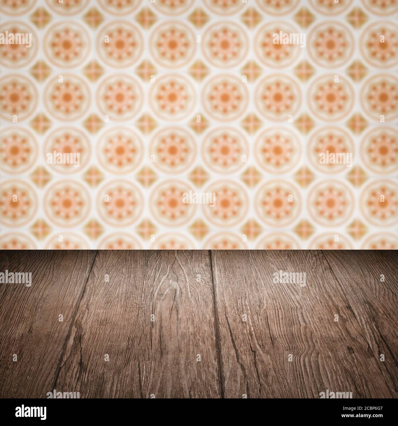 Empty wood table top and blur vintage ceramic tile pattern wall in ...