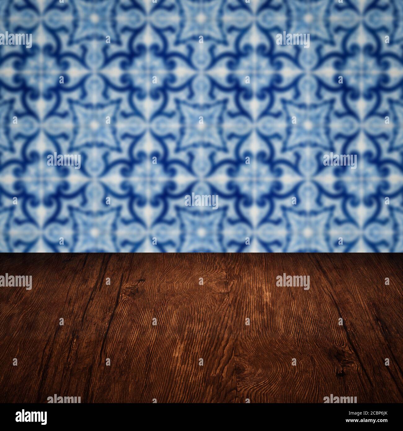 Empty wood table top and blur vintage ceramic tile pattern wall in ...