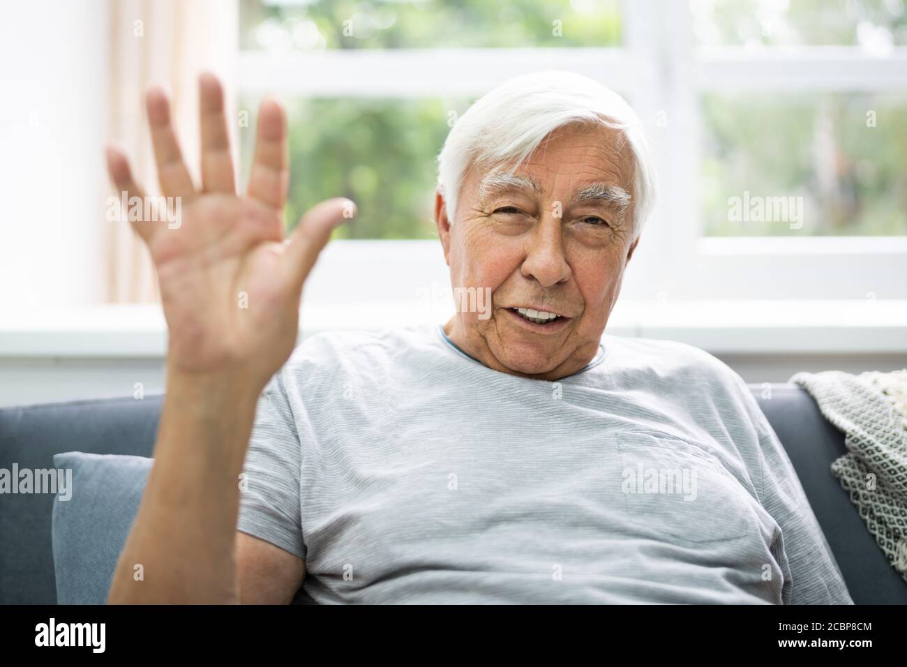 Portrait senior man waving hi-res stock photography and images - Alamy