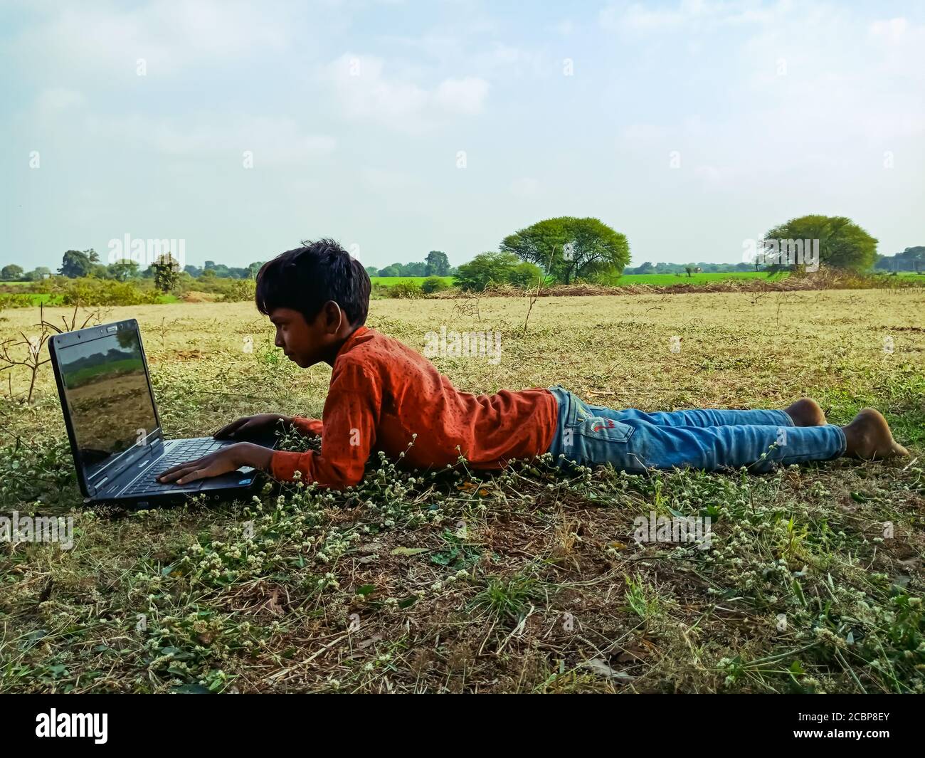DISTRICT KATNI, INDIA - JANUARY 01, 2020: An indian boy lying on the ...