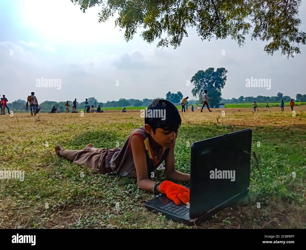 DISTRICT KATNI, INDIA - JANUARY 01, 2020: An indian poor boy lying on ...