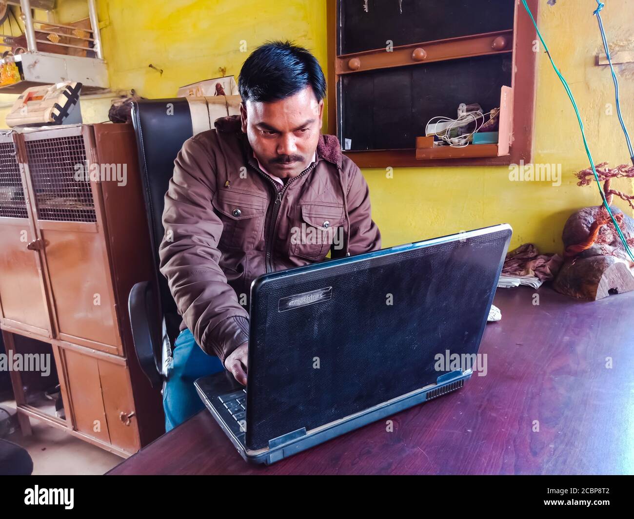 DISTRICT KATNI, INDIA - JANUARY 01, 2020: An indian office man working ...