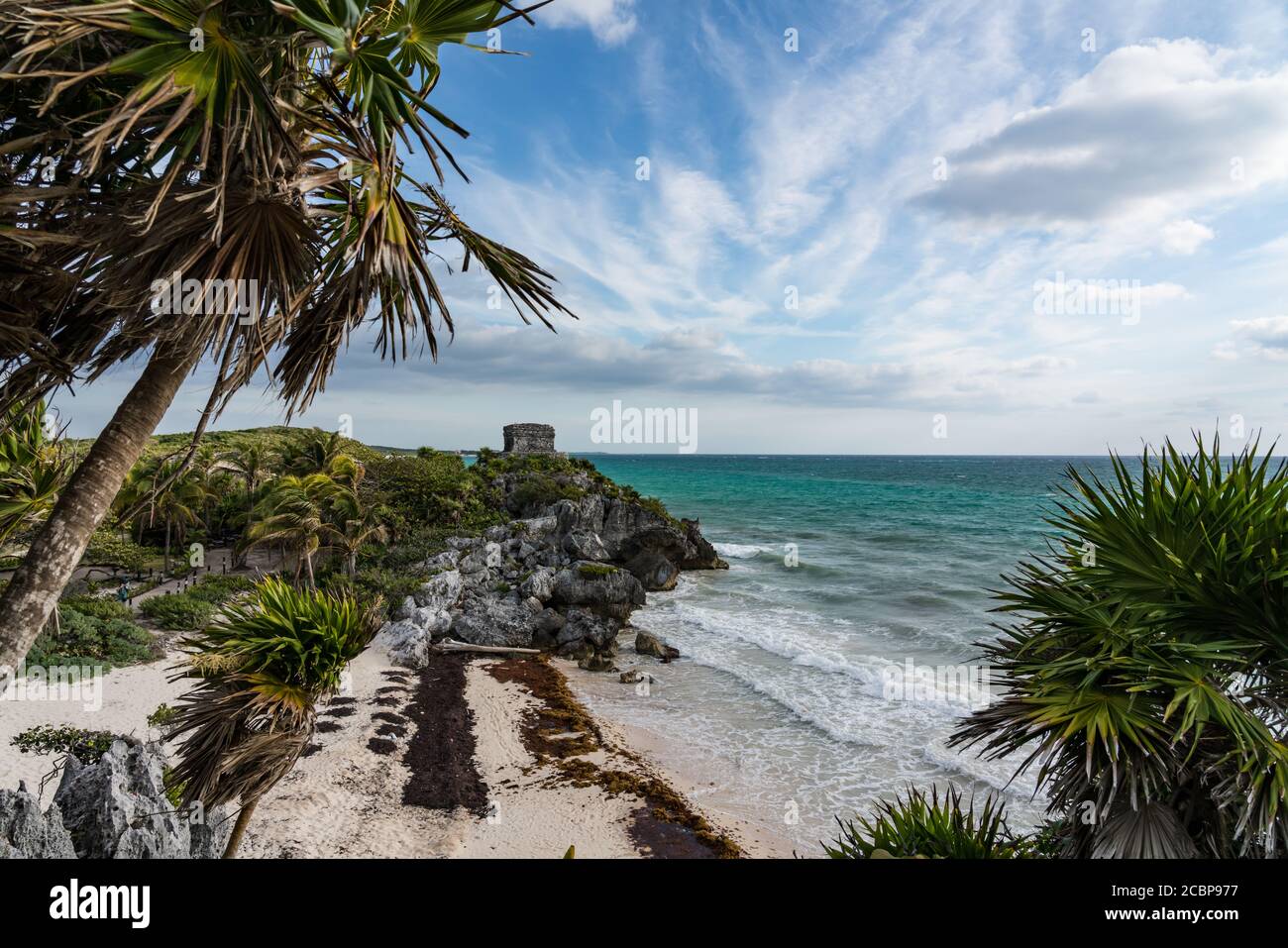 The Temple of the Wind God in the ruins of the Mayan city of Tulum on ...