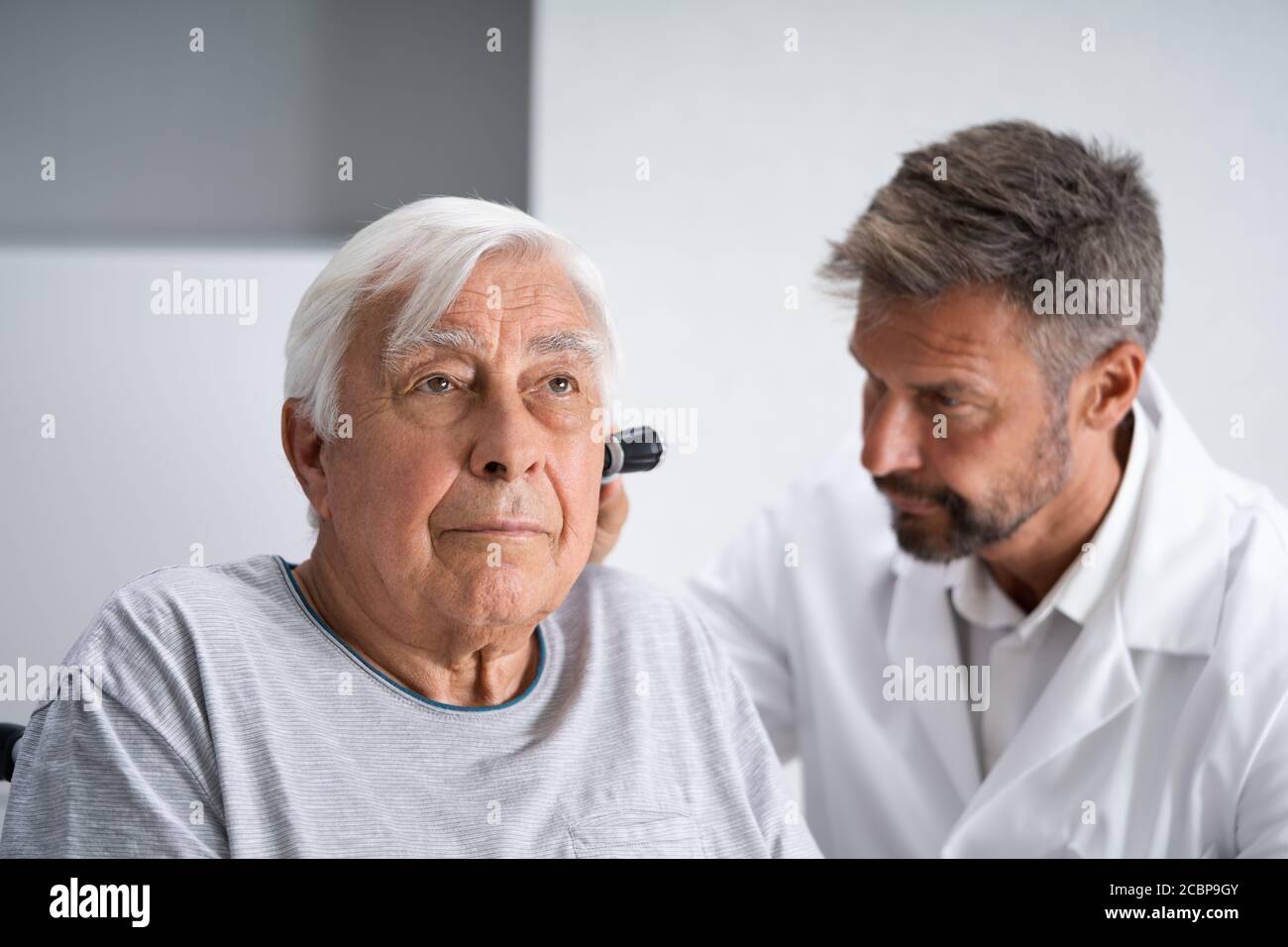 Otolaryngology Check. Doctor Checking Ear Using Otoscope Stock Photo ...