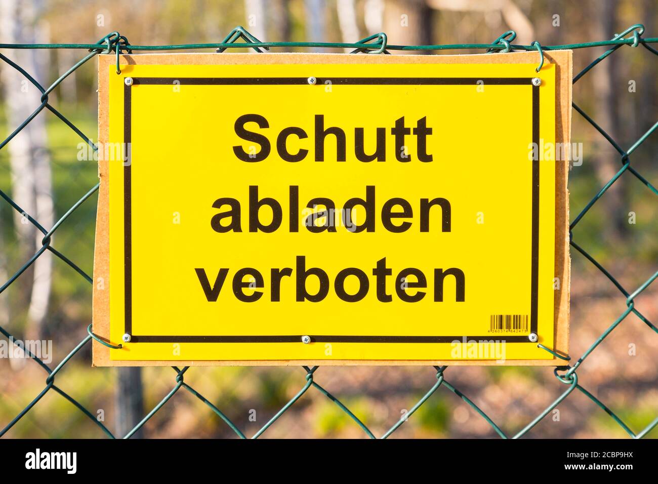 Yellow sign, dumping of rubble prohibited, Germany Stock Photo - Alamy