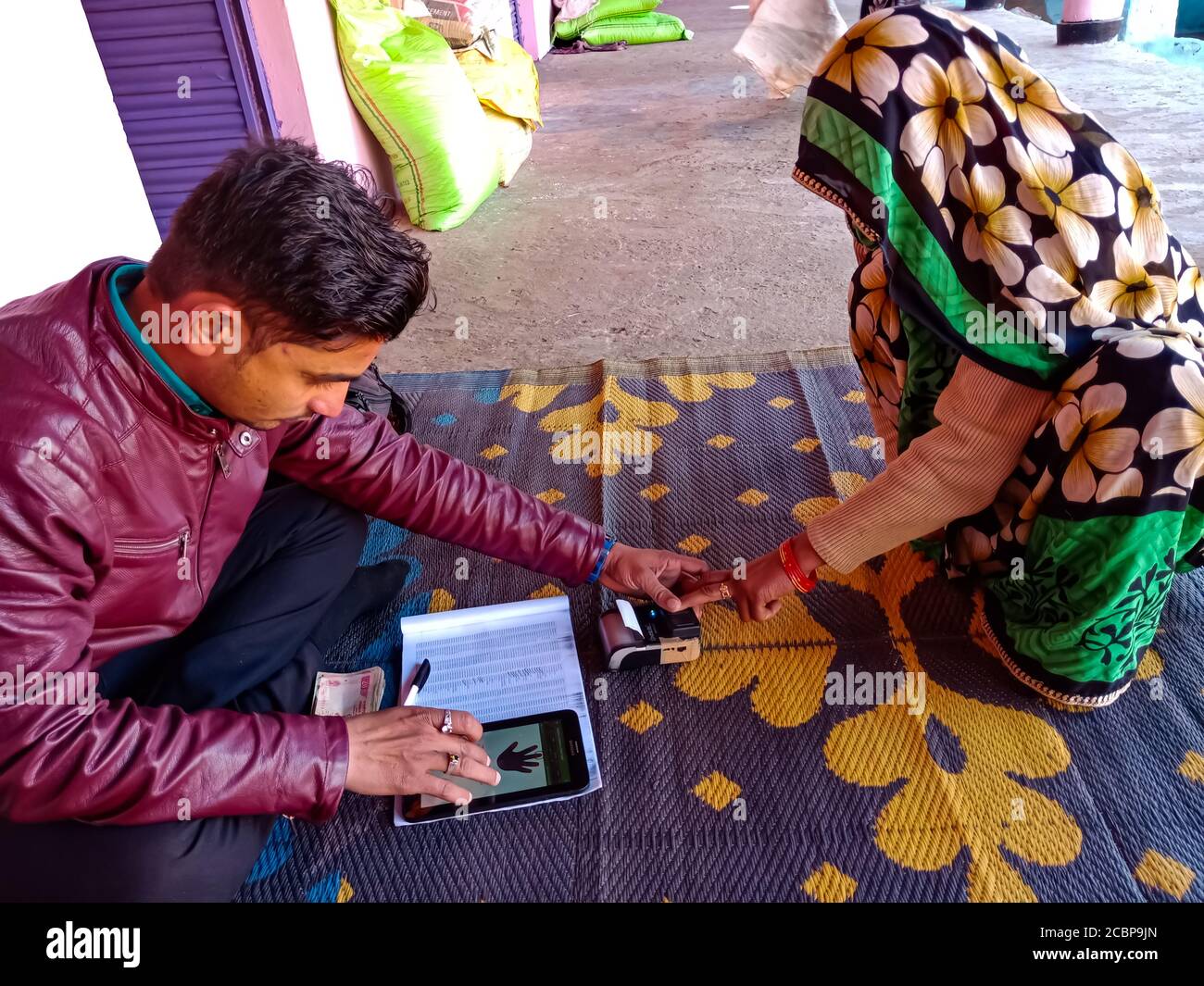 DISTRICT KATNI, INDIA - JANUARY 25, 2020: An indian bank officer taking ...