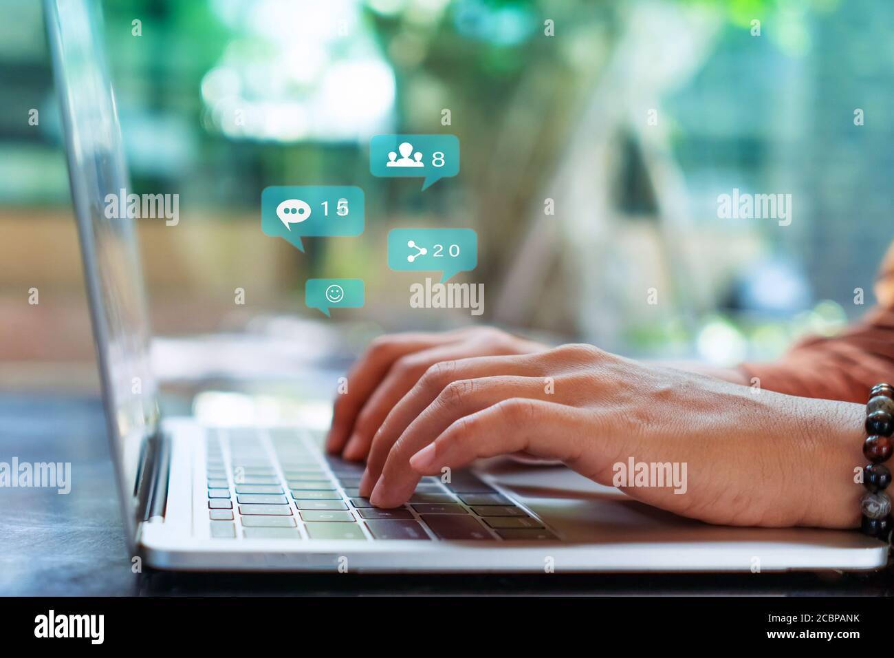 Hand typing keyboard with laptop computer with social media and ...