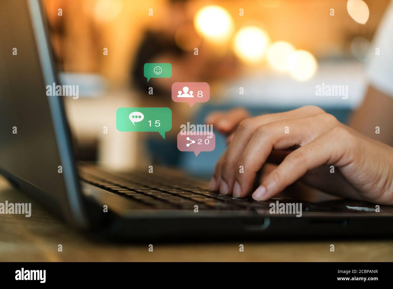 Hand typing keyboard with laptop computer with social media and ...