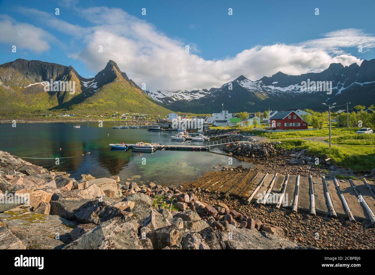 Boat ramp and fishing boats on the fjord in Mefjord, Senja Island ...