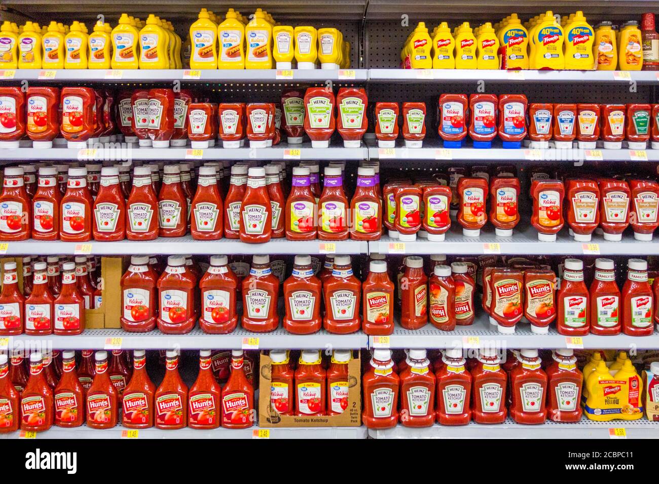 Full shelves at Walmart, supermarket, ketchup and mustard, different ...
