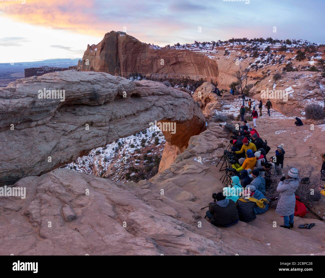 Arch Mesa Arch at sunrise, many photographers and tourists, Colorado ...
