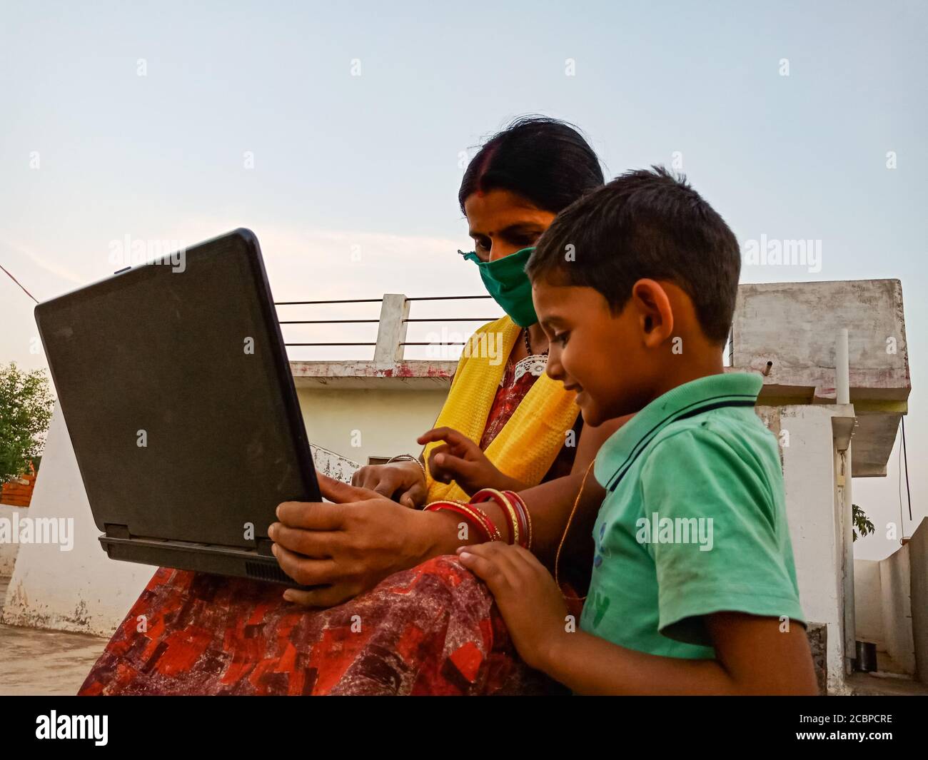 DISTRICT KATNI, INDIA - MAY 23, 2020: An indian poor lady learning ...