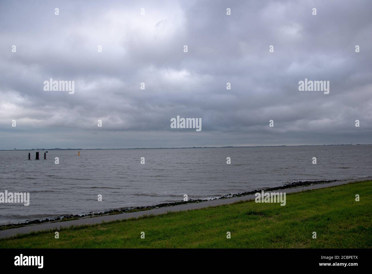 Beautiful view of a calm sea during a gloomy weather Stock Photo - Alamy