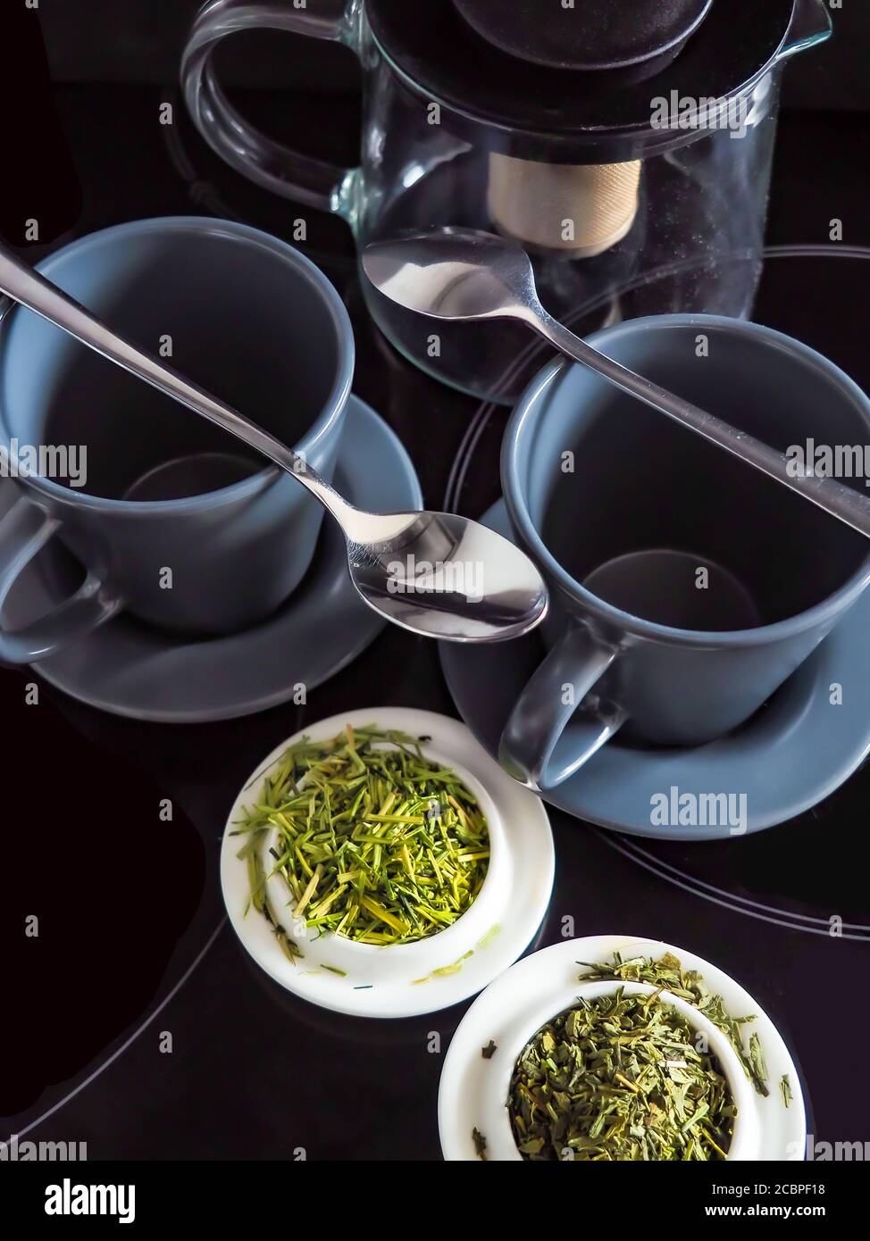 Vertical shot of green tea, teacups, and a teahouse Stock Photo - Alamy