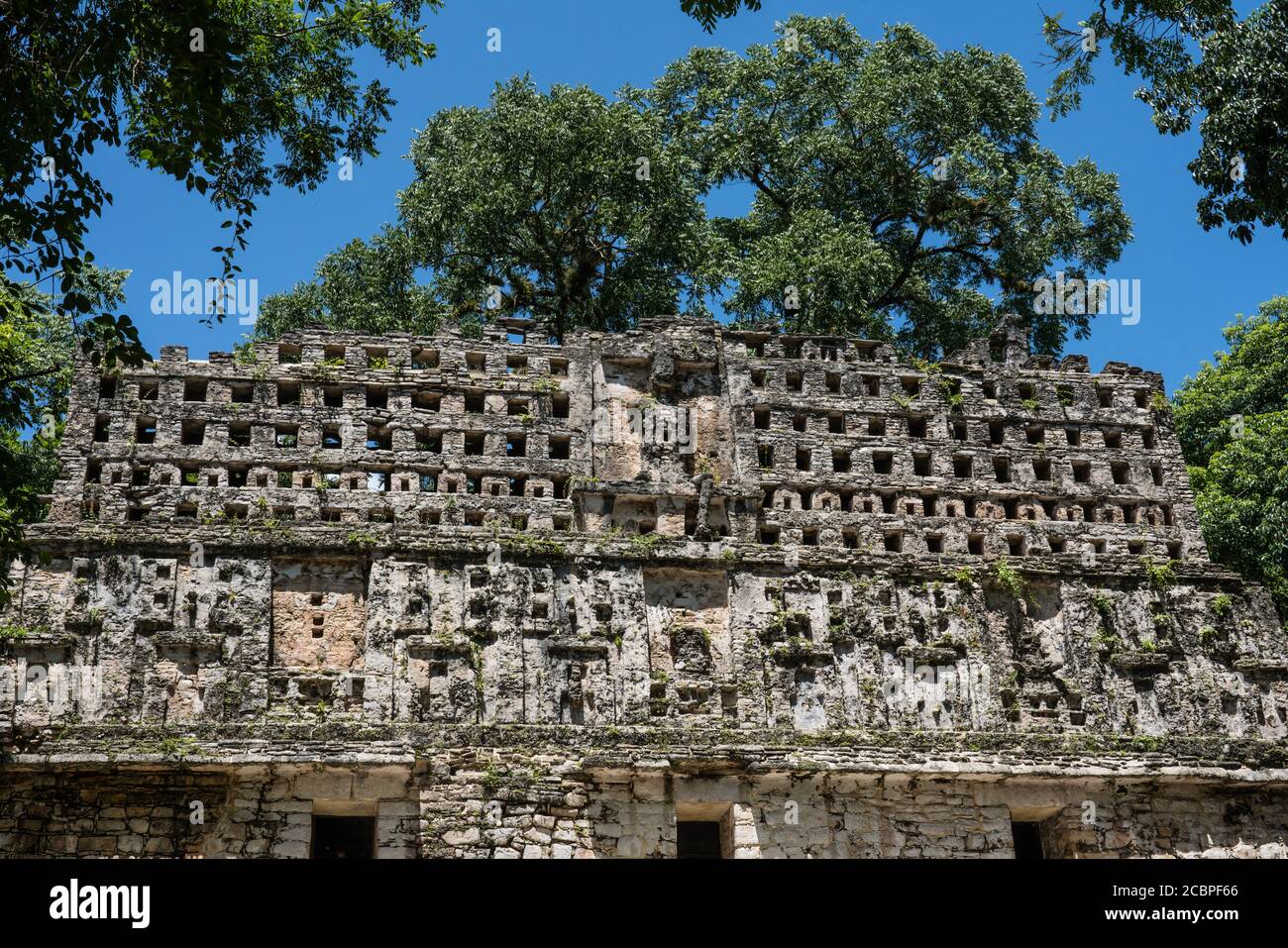 The roof comb of Temple 33 in the ruins of the Mayan city of Yaxchilan ...