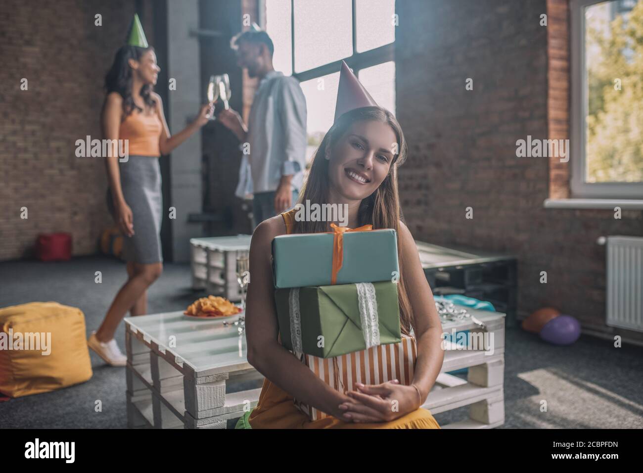 Birthday party woman getting present hi-res stock photography and ...