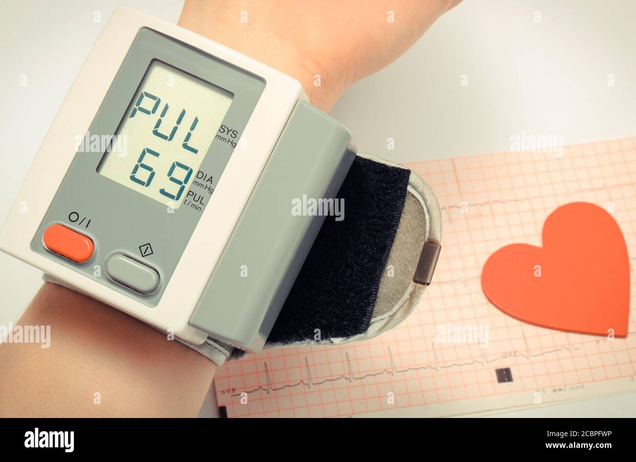 Measuring blood pressure and heart shape on electrocardiogram graph ...