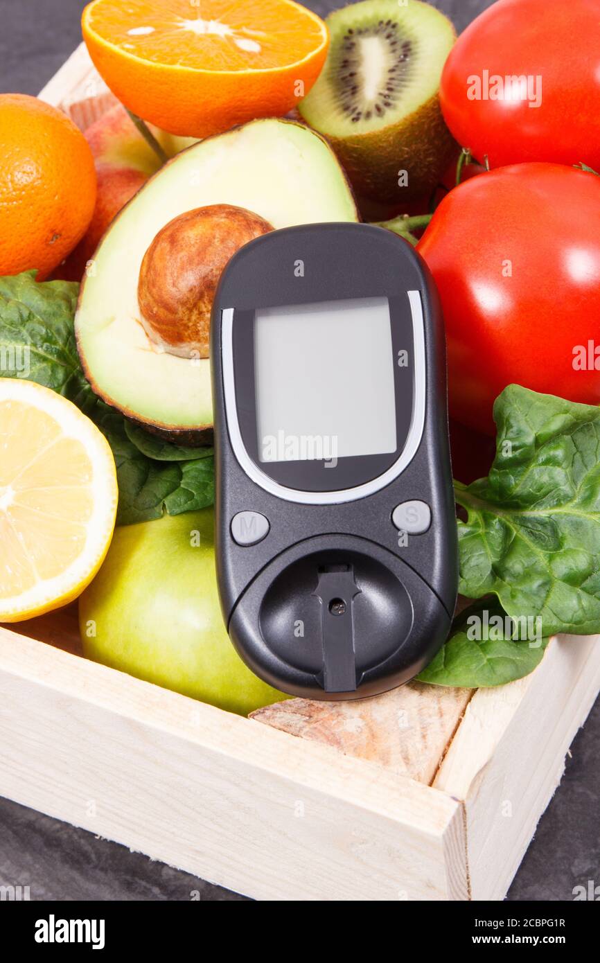 Glucometer for checking sugar level and healthy fruits and vegetables ...