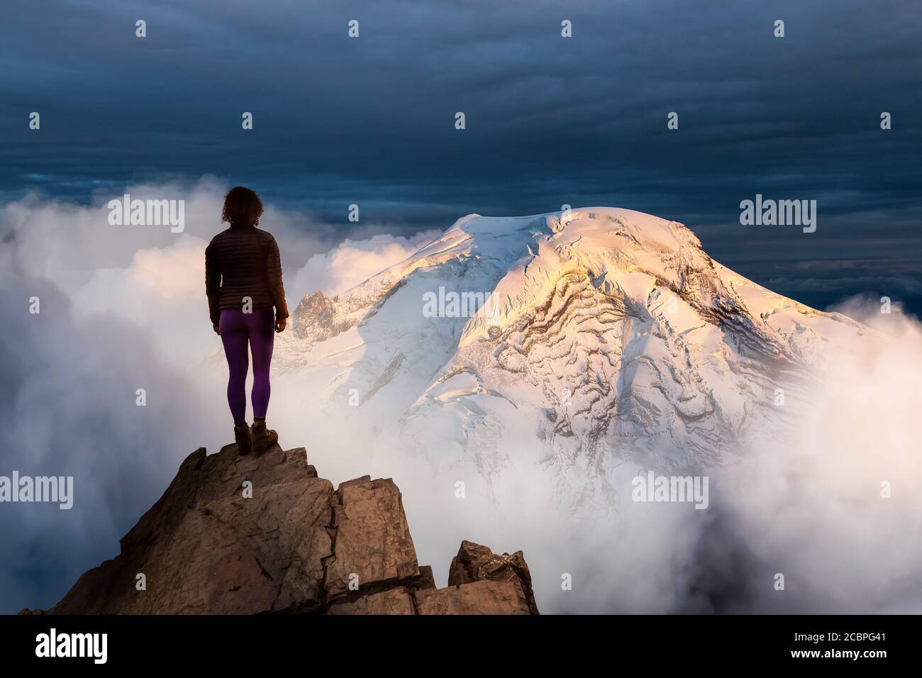 Adventure Dreamscape. Girl on top of a Rocky Mountain Cliff Stock Photo ...