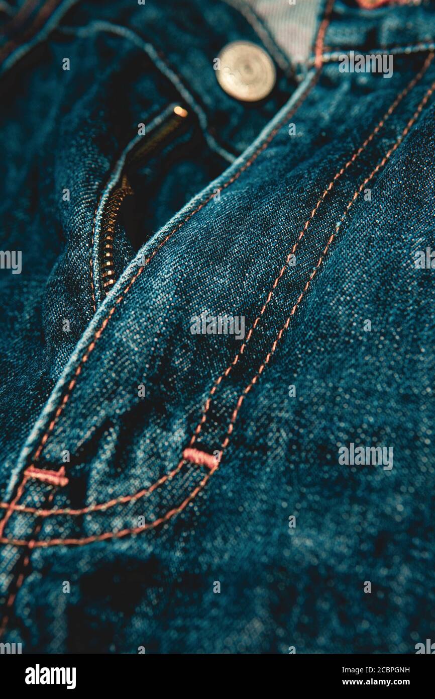 Vertical shot of a zipper on blue jeans Stock Photo - Alamy