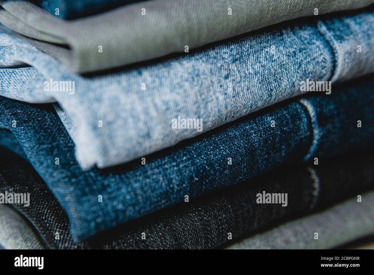 Stack of neatly folded jeans Stock Photo - Alamy