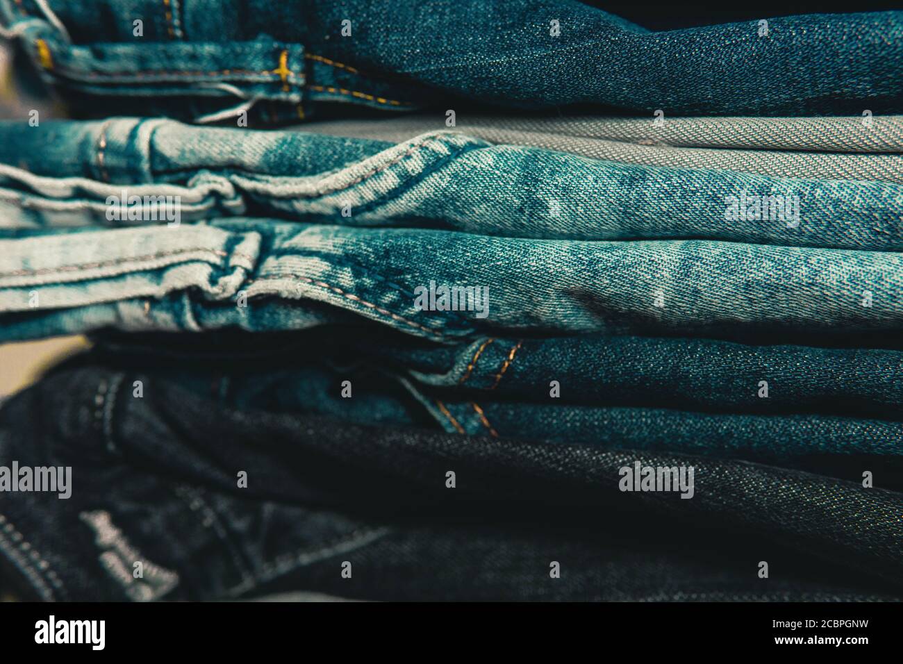 Stack of neatly folded jeans Stock Photo - Alamy